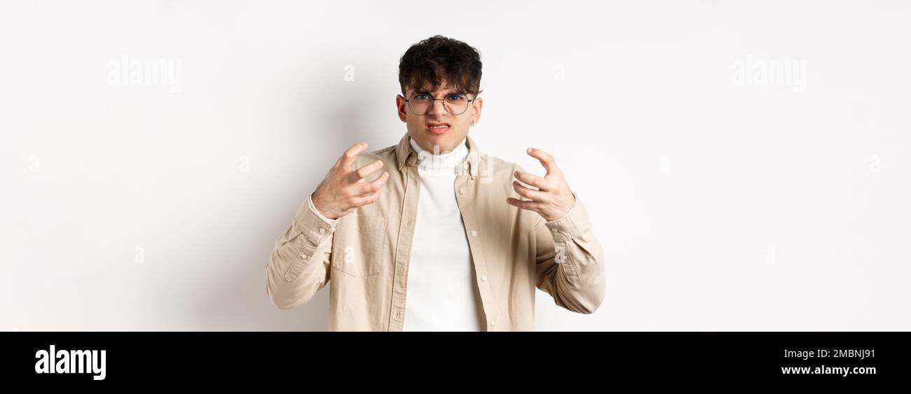 Portrait of annoyed and mad guy wants to strangle someone, grimacing ...