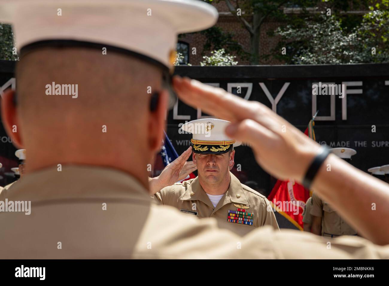 U.S. Marine Corps Col. Phillip N. Ash, left, salutes Maj. James P ...