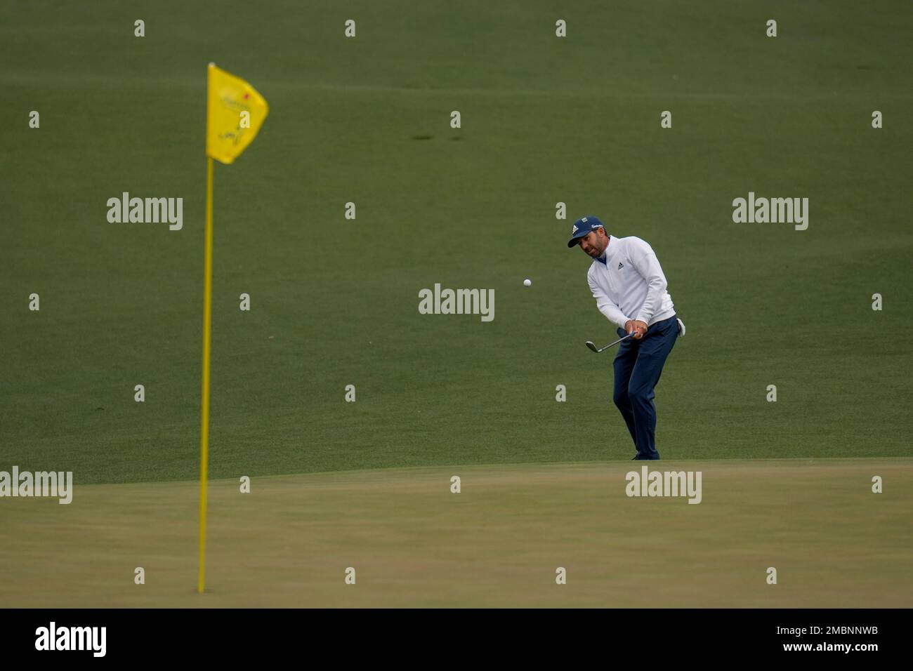 Sergio Garcia, of Spain, chips to the second green during the third ...