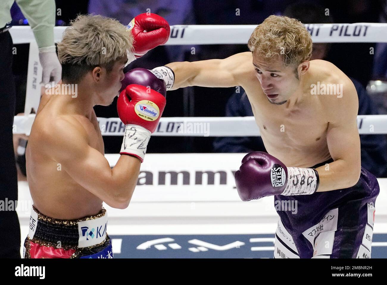 Japan's Shuichiro Yoshino sends a right to compatriot Masayuki Ito during their WBO Asia Pacific ...