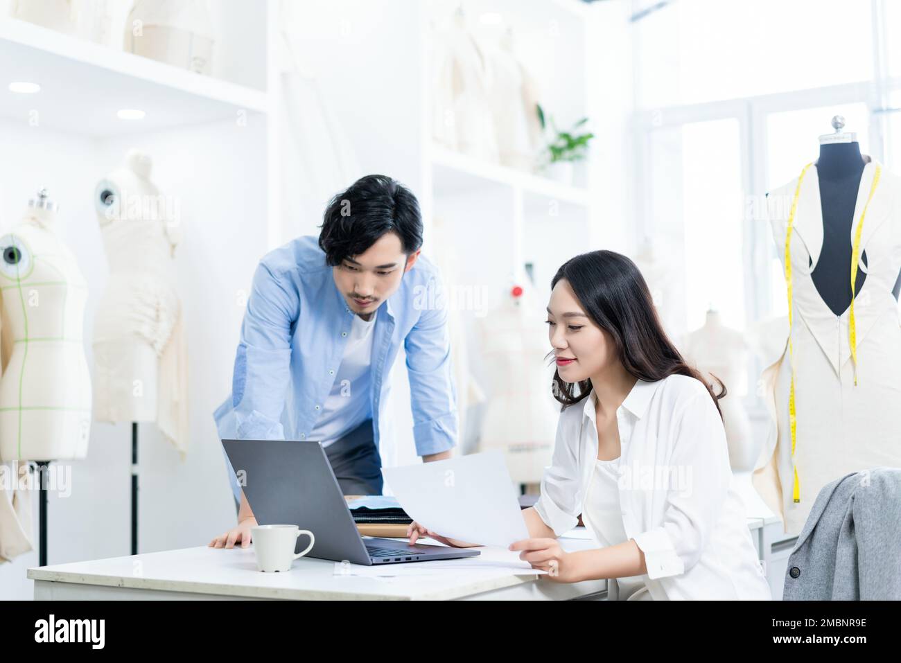 Two positive designers holding hi-res stock photography and images - Alamy