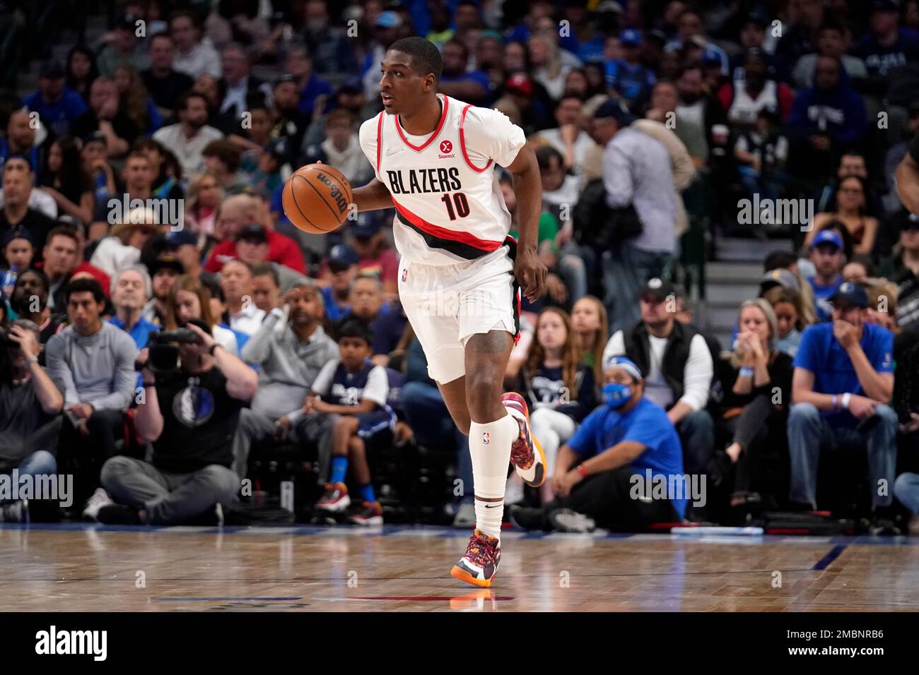 Portland Trail Blazers forward Reggie Perry advances the ball up court ...