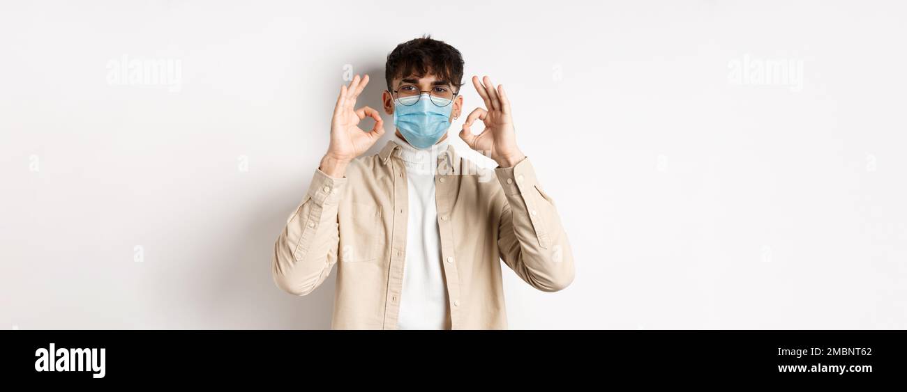 Covid-19, health and real people concept. Handsome guy in glasses and ...