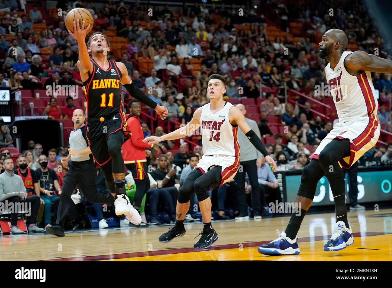 Atlanta Hawks guard Trae Young (11) goes to the basket as Miami Heat ...