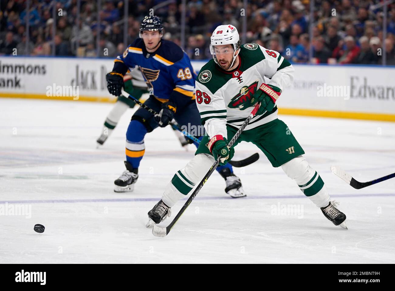 Minnesota Wild's Frederick Gaudreau (89) passes as St. Louis Blues ...