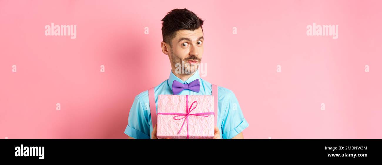 Holidays and celebration concept. Funny guy with moustache showing cute ...