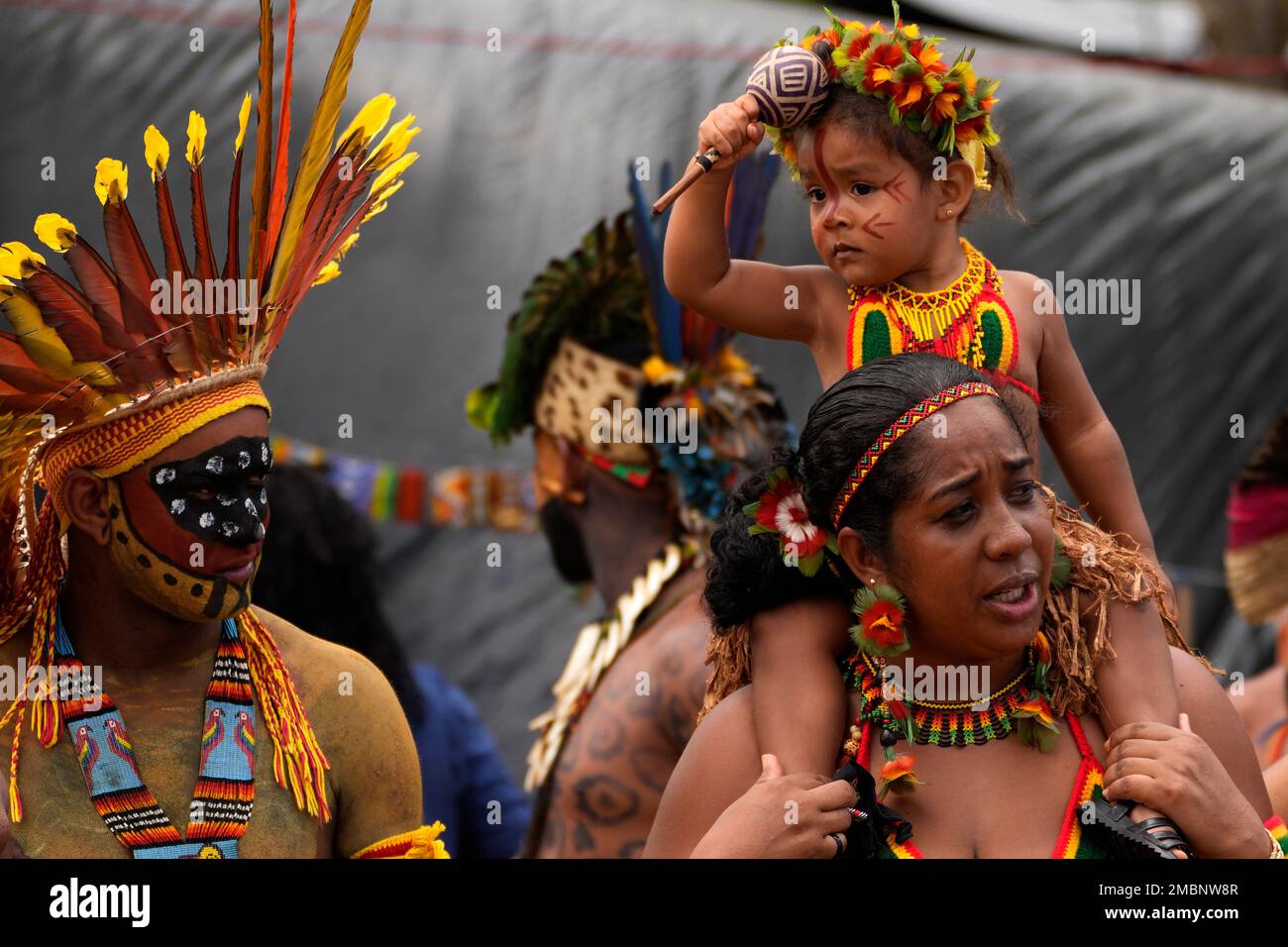 A Pataxo Indigenous couple and their child attend a ceremony called the ...