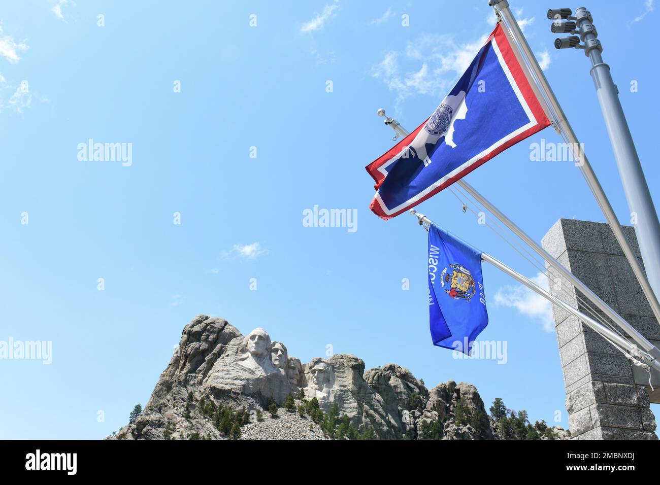 The Wyoming state flag flies at the base of Mount Rushmore National ...