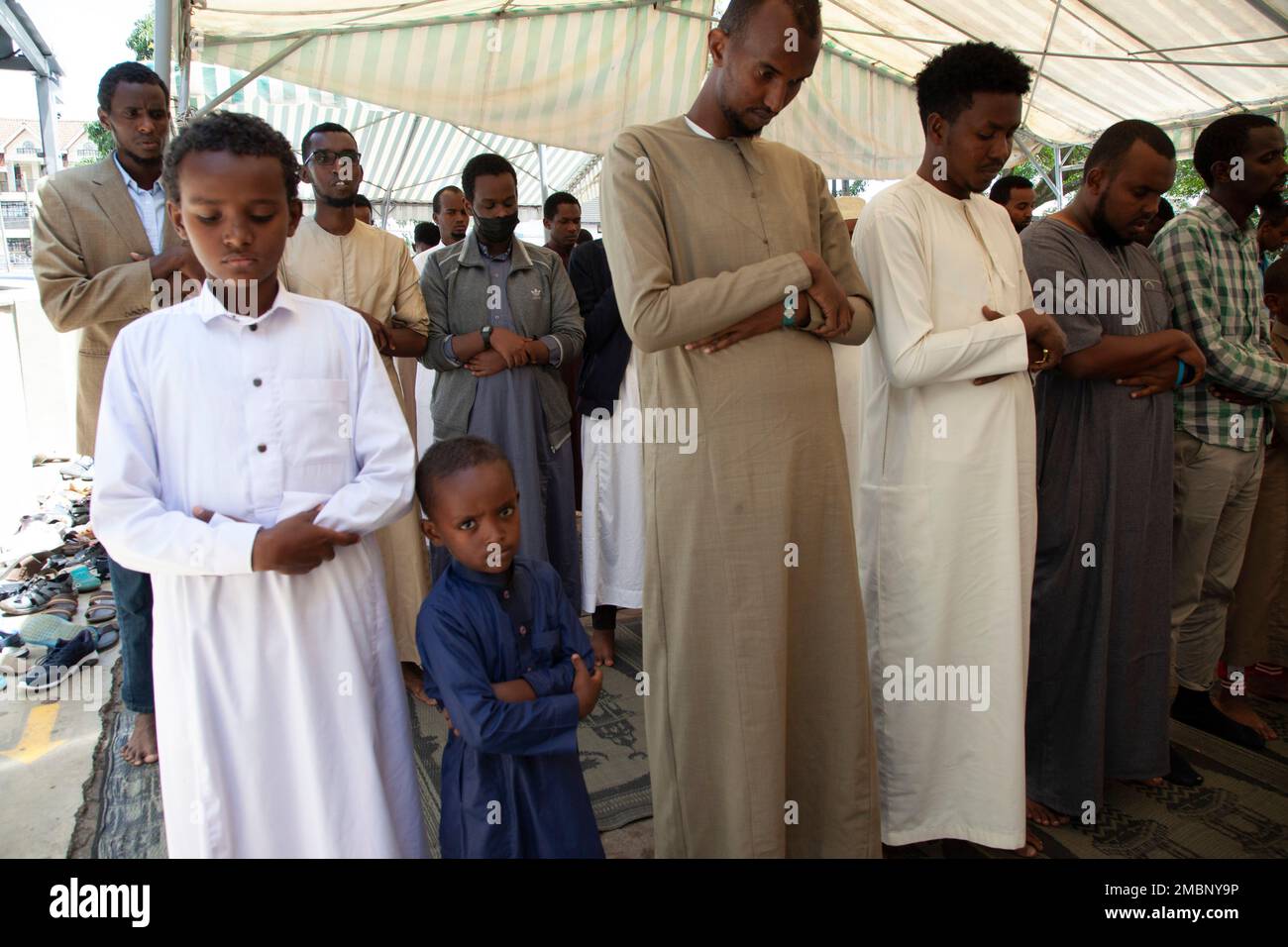 Muslims stand for First Friday prayer of the Muslim Holy month of ...