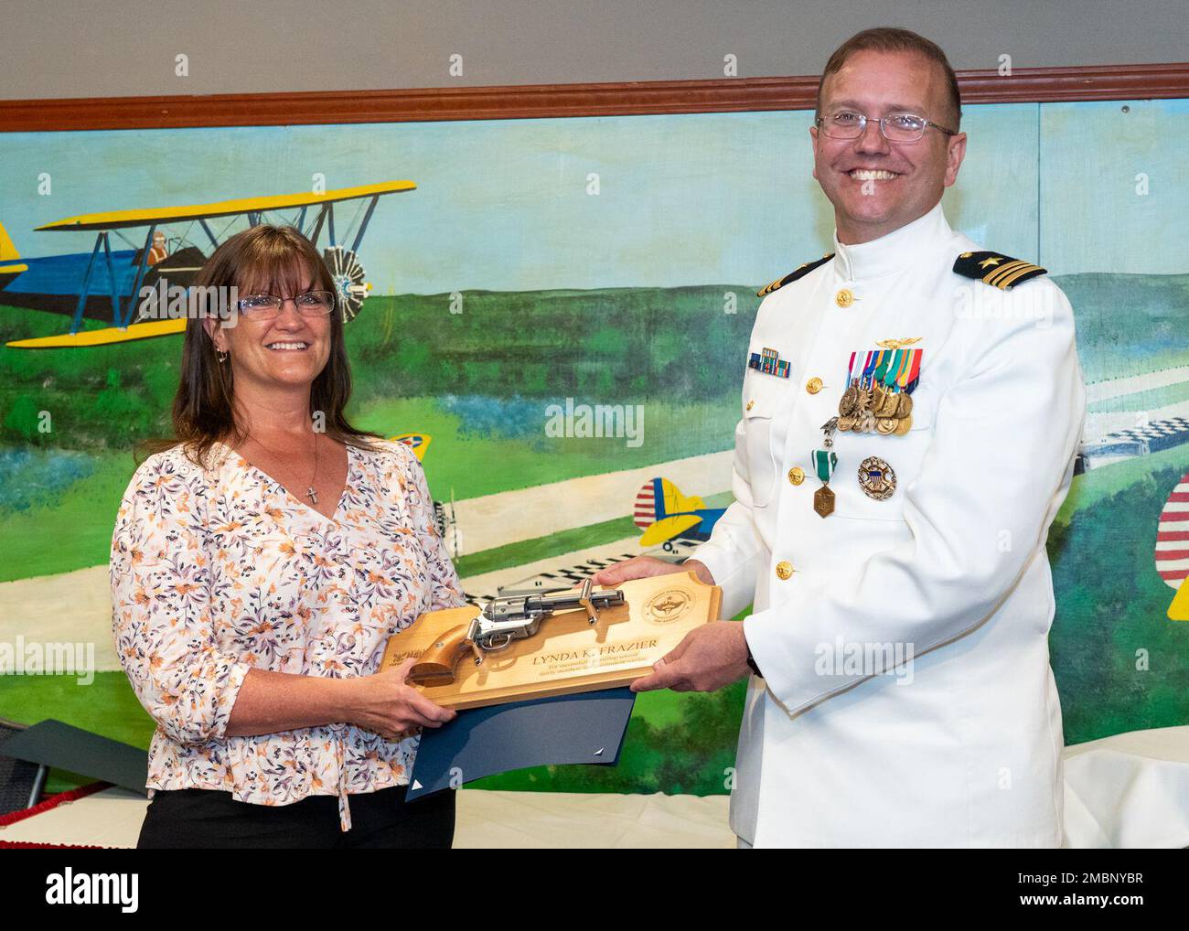 220617-N-XY052-1396: SAN ANTONIO– (June 17, 2022) Lieutenant Commander John M. Griffith presents ...