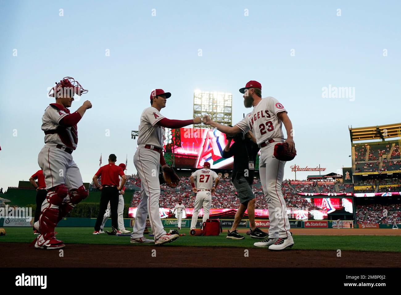 Los Angeles Angels starting pitcher Shohei Ohtani bumps fists with ...