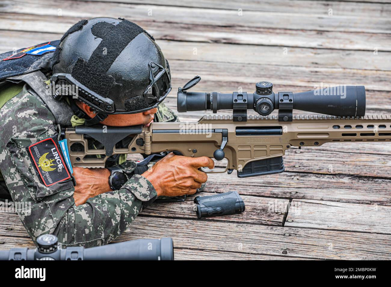A Honduran sniper prepares to fire down range during the combine sniper ...