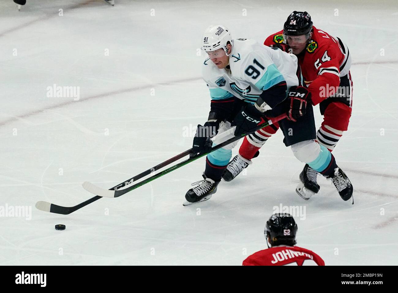 Seattle Kraken right wing Daniel Sprong (91) controls the puck past ...
