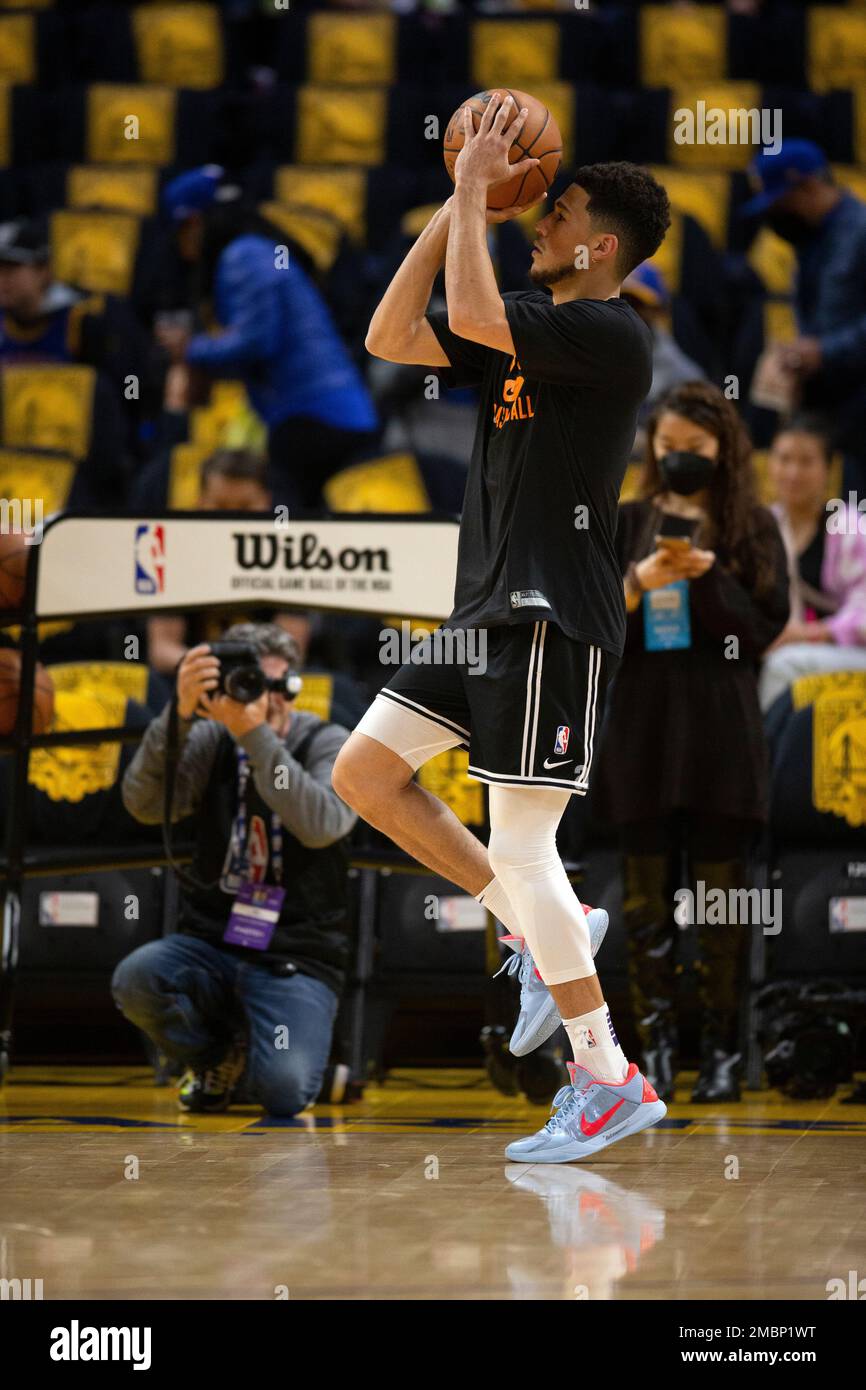 Phoenix Suns guard Devin Booker practices his shooting before an NBA ...