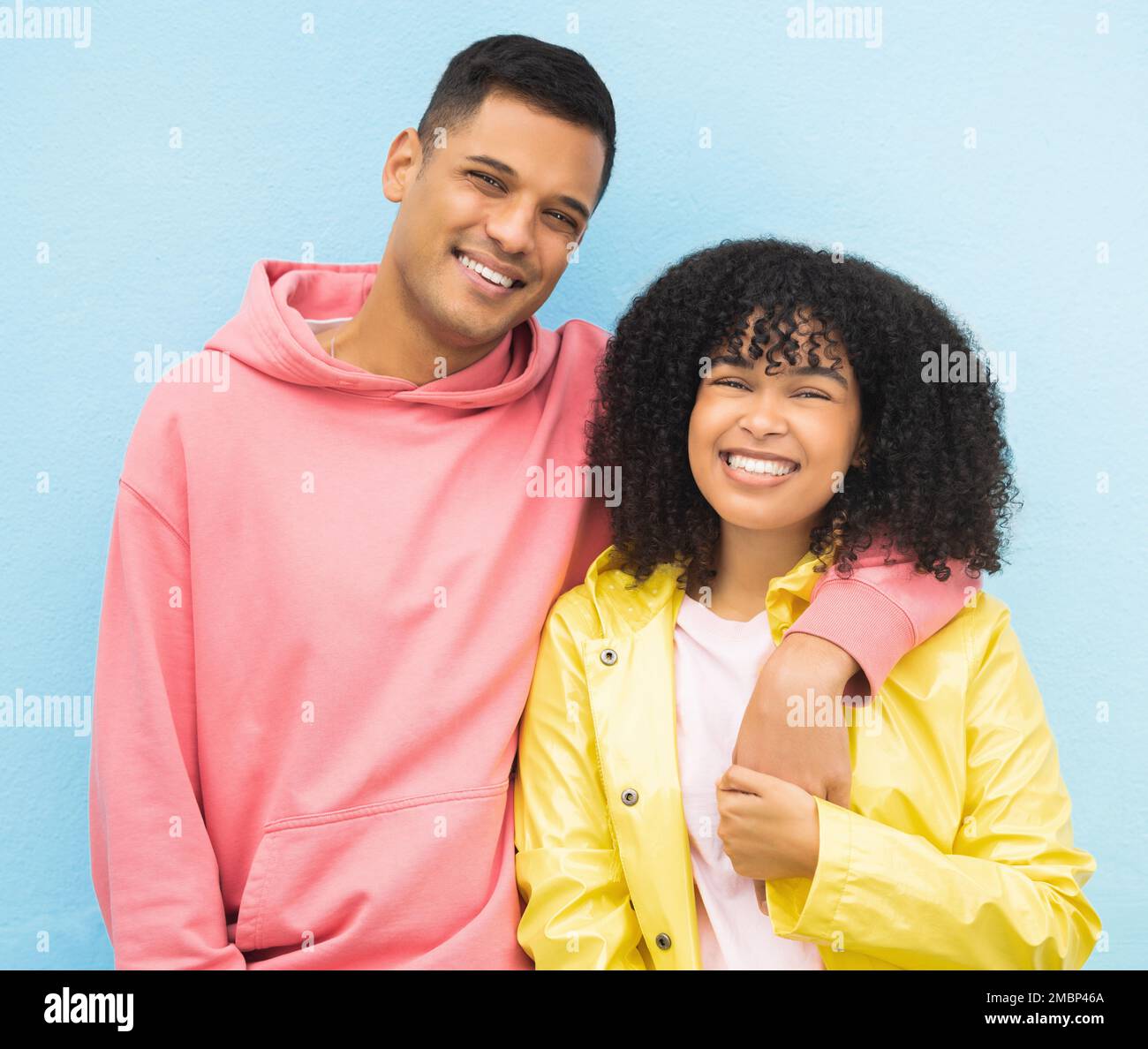 Happy couple, smile portrait and cool fashion standing in blue ...