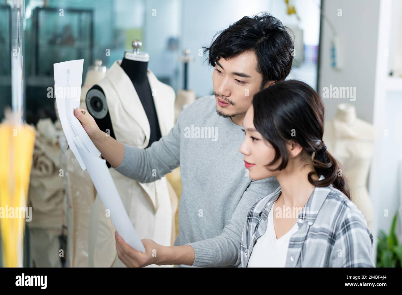 Two positive designers holding hi-res stock photography and images - Alamy