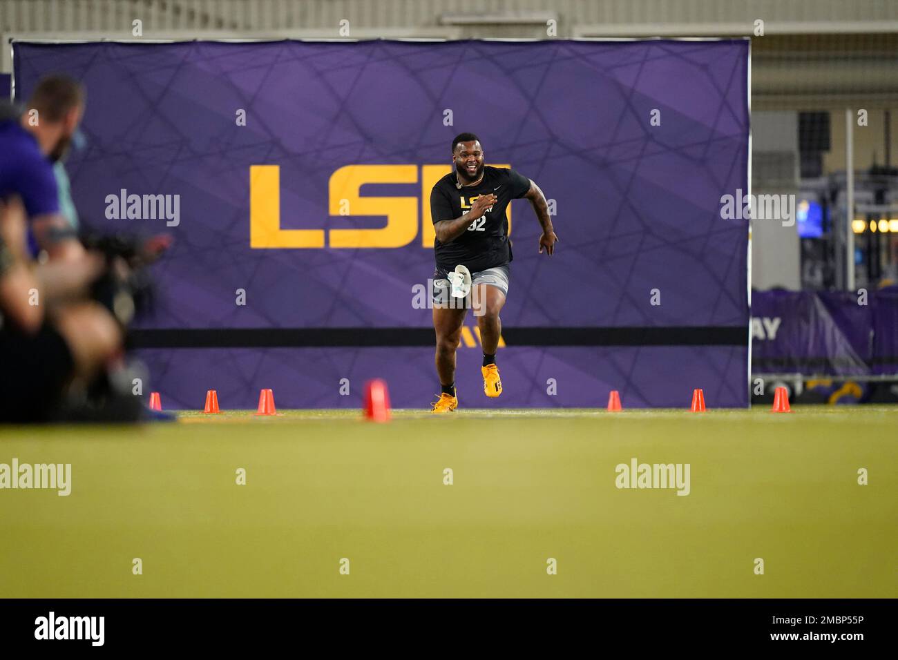 LSU defensive tackle Neil Farrell Jr. runs through drills during LSU ...