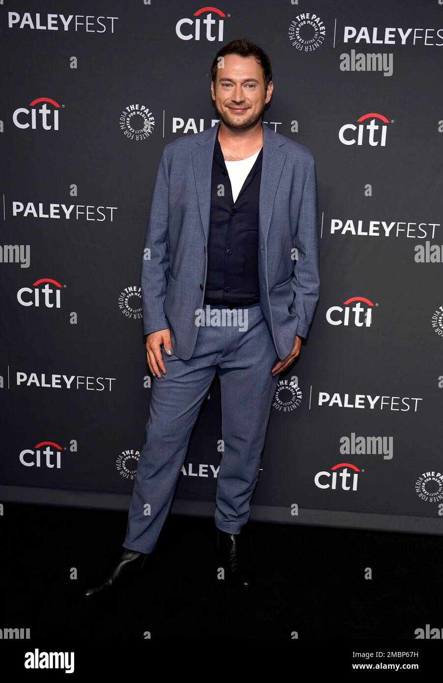 Brandon Scott Jones, a cast member in the CBS series "Ghosts," poses ...