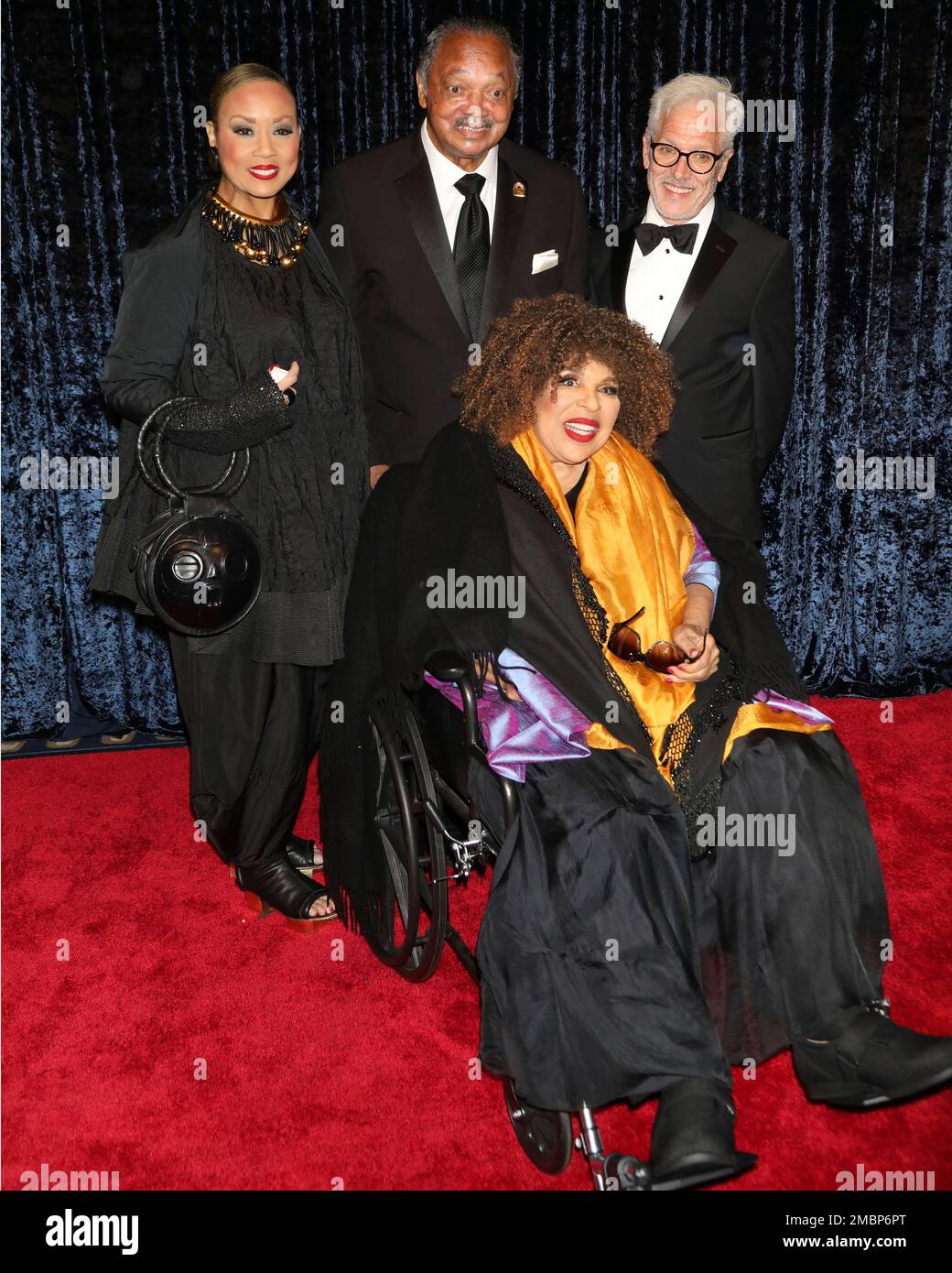 The Rev. Jesse Jackson, center, and Roberta Flack, front, attend Clive ...