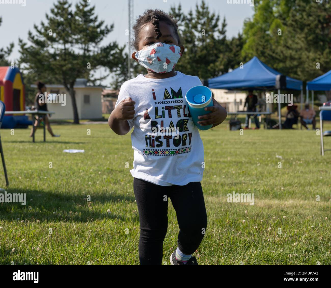 A military child runs around during the Juneteenth Family Reunion event ...