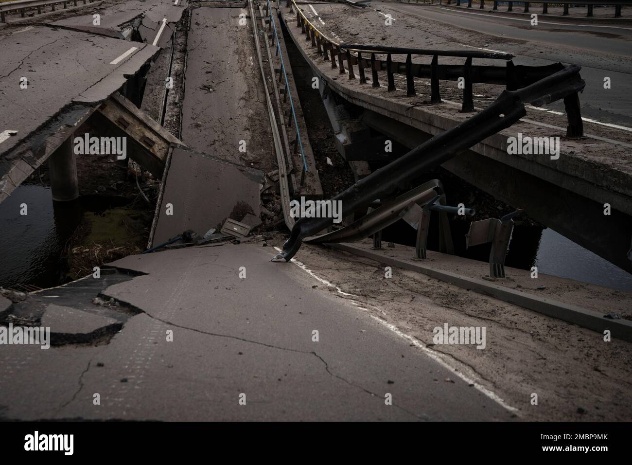 The Irpin river is seen under a damaged bridge in Bucha, on the ...