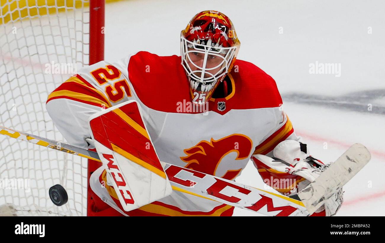 Calgary Flames goalie Jacob Markstrom (25) looks at a puck in the air during the third period of ...