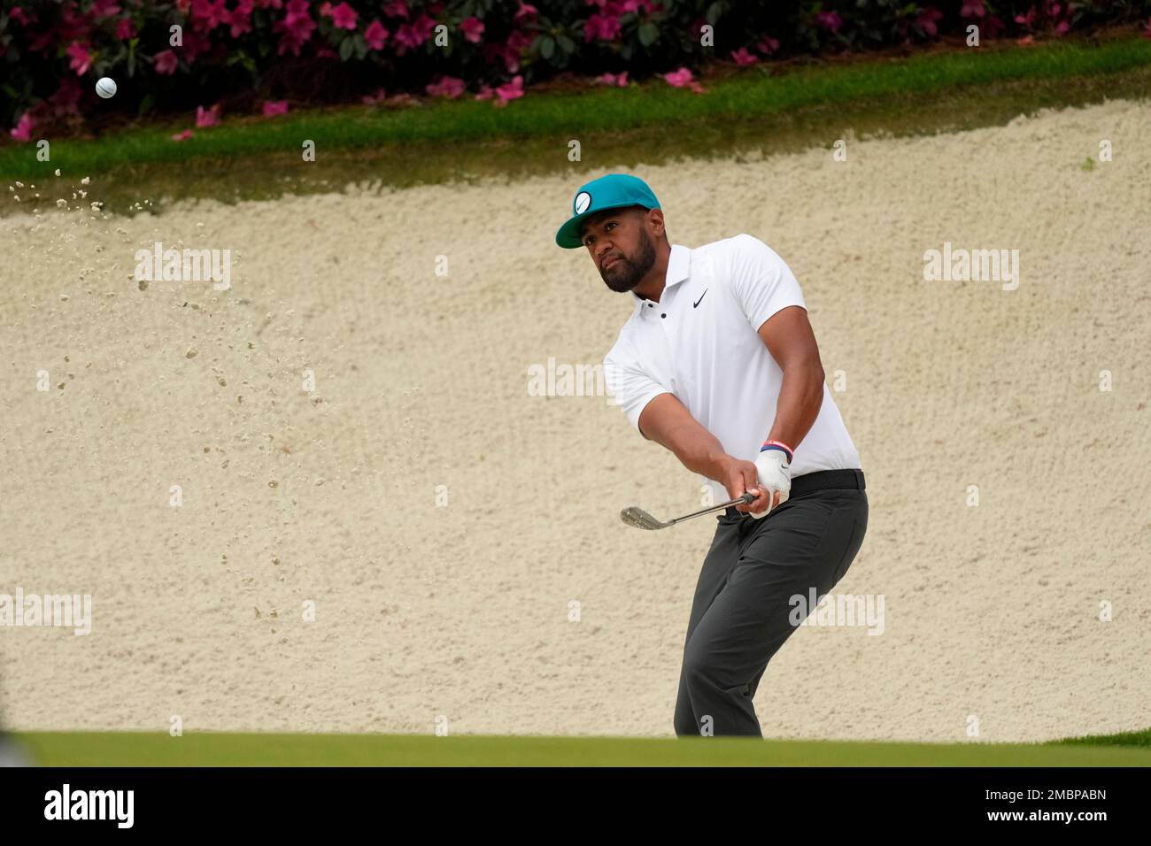 Tony Finau hits out of a bunker on the 13th hole during a practice ...