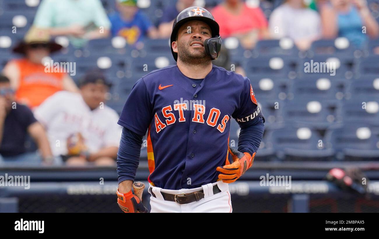 Houston Astros' Jose Altuve bats during a spring training baseball game ...