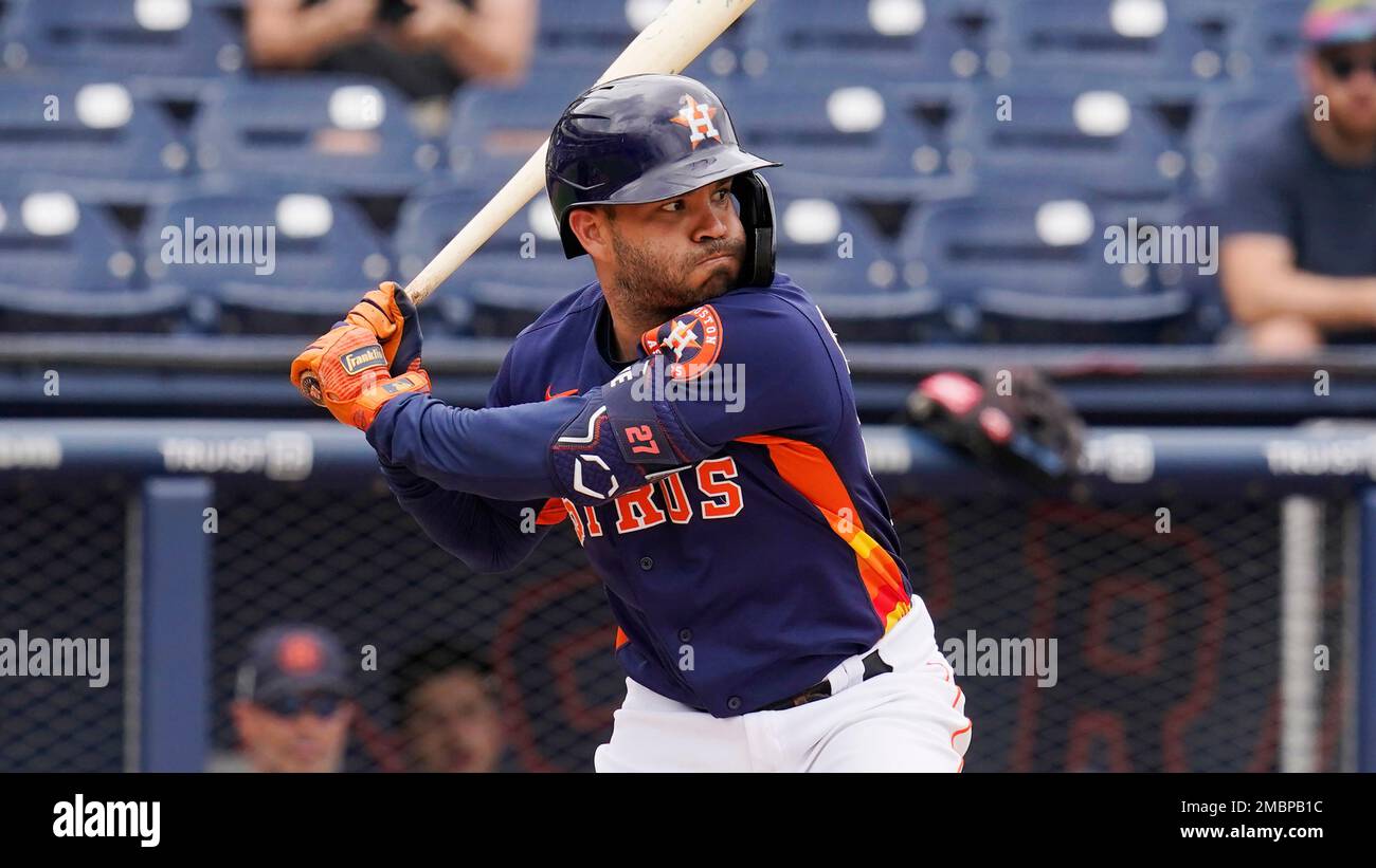 Houston Astros' Jose Altuve bats during a spring training baseball game ...