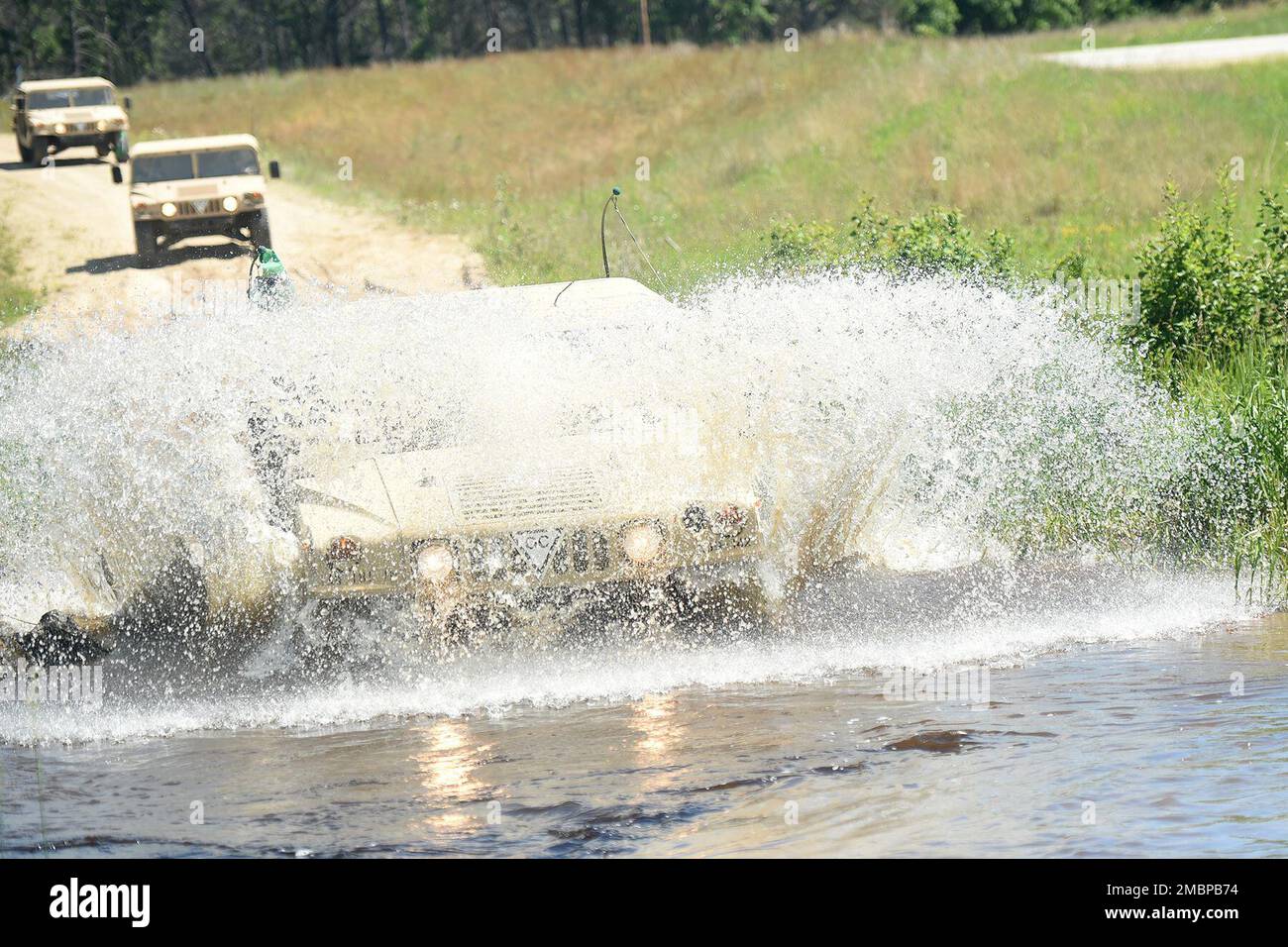 U.S. Army Reserve Soldiers navigate Humvees through water passings ...