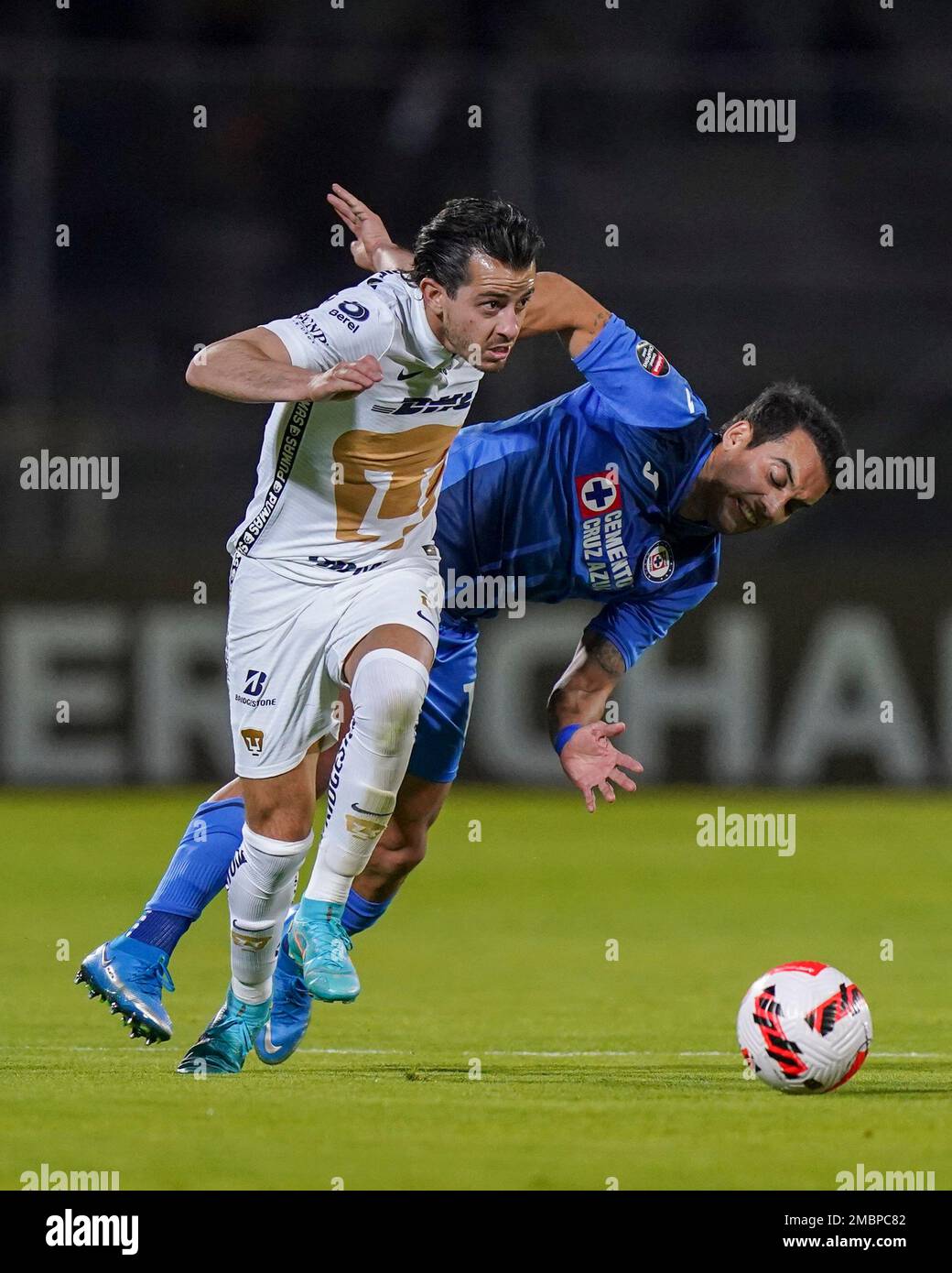 Alan Mozo of Mexico's Pumas, front, is challenged by Adrian Aldrete of ...