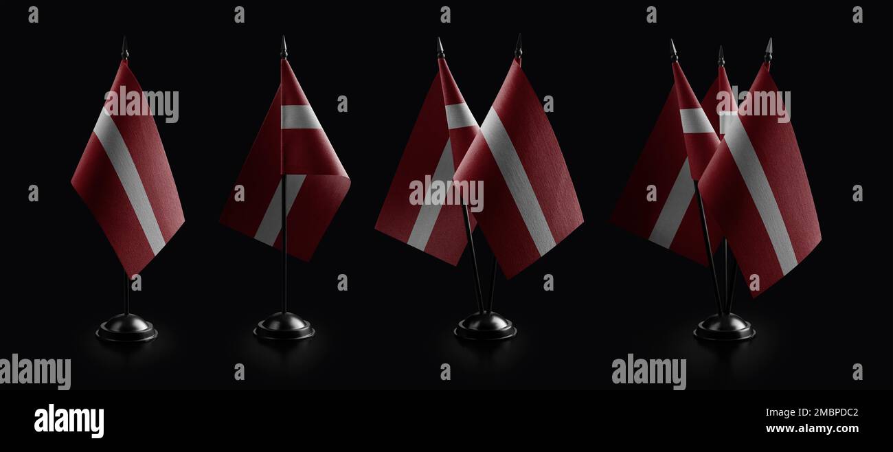 Small national flags of the Latvia on a black background Stock Photo ...