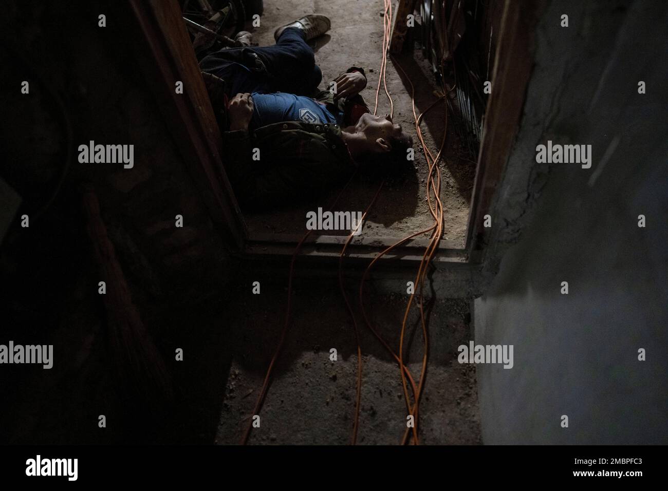 EDS NOTE: GRAPHIC CONTENT - The corpse of a man is seen in the basement ...