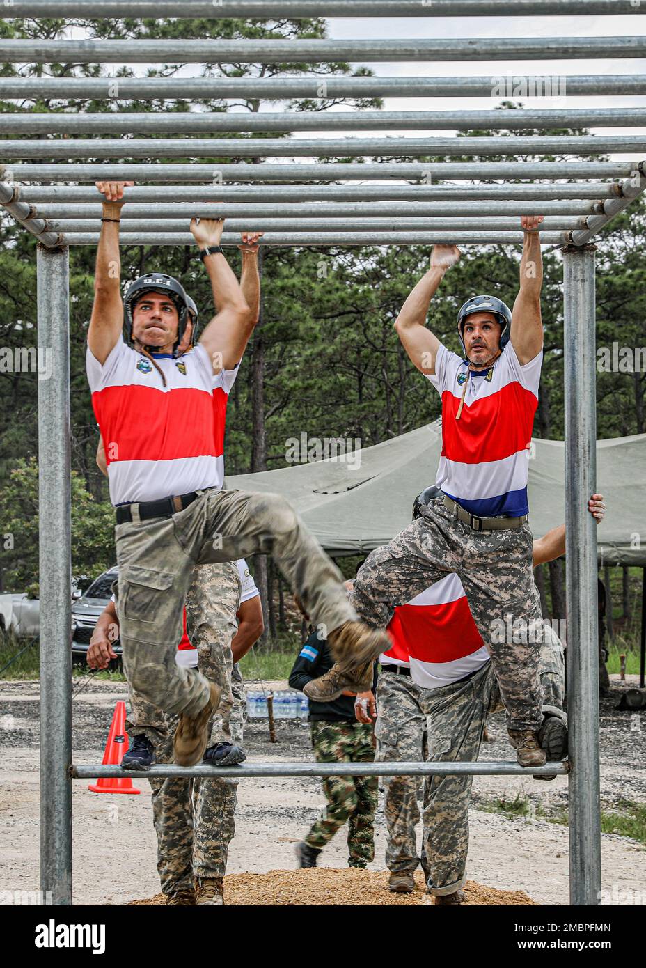 The Costa Rican team runs through the obstacle course for the Fuerzas ...