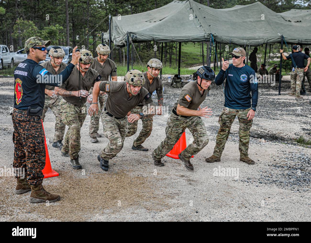 The United States team prepares to runs through the obstacle course for ...