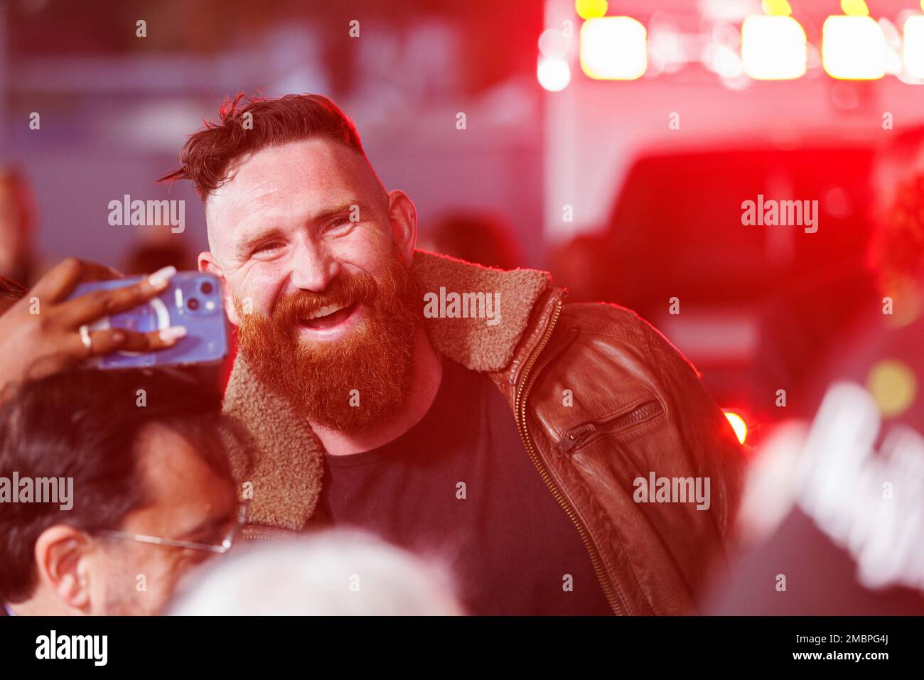Devan Long takes a selfie with some fans as he arrives at the premiere ...