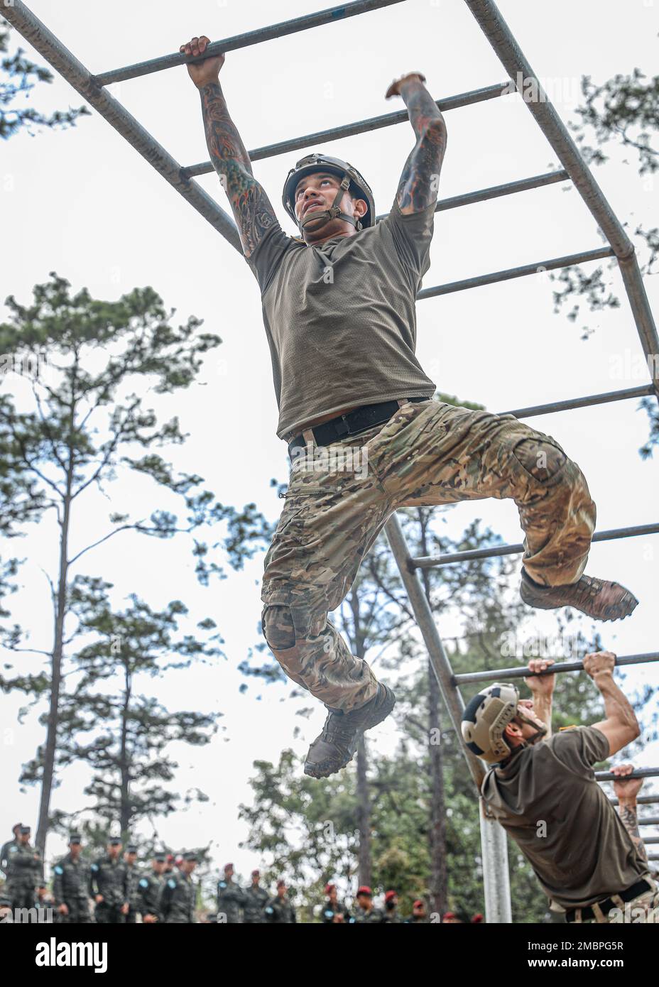 A United States team member runs through the obstacle course for the ...
