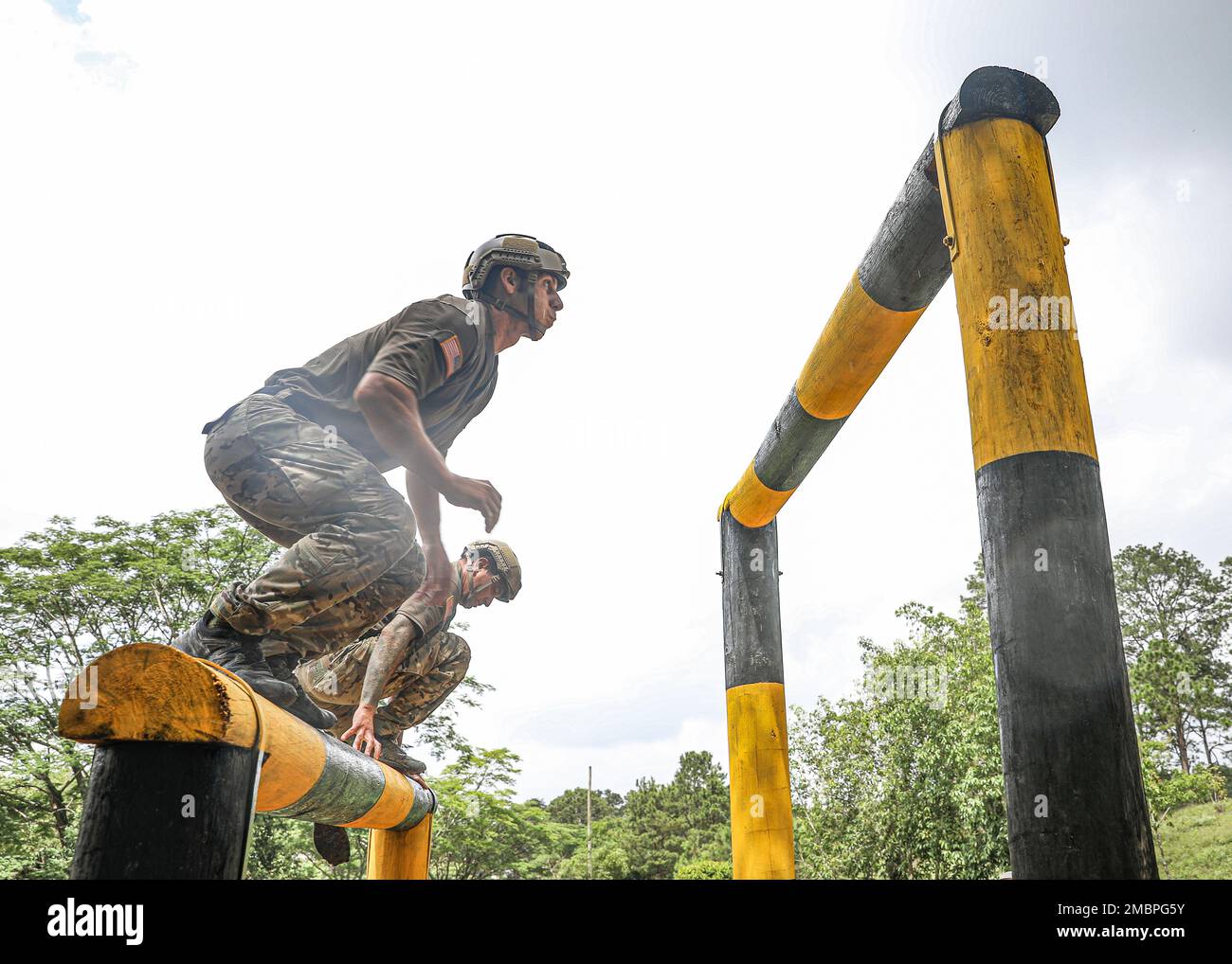 United States team members prepares to jump over an obstacle during the ...