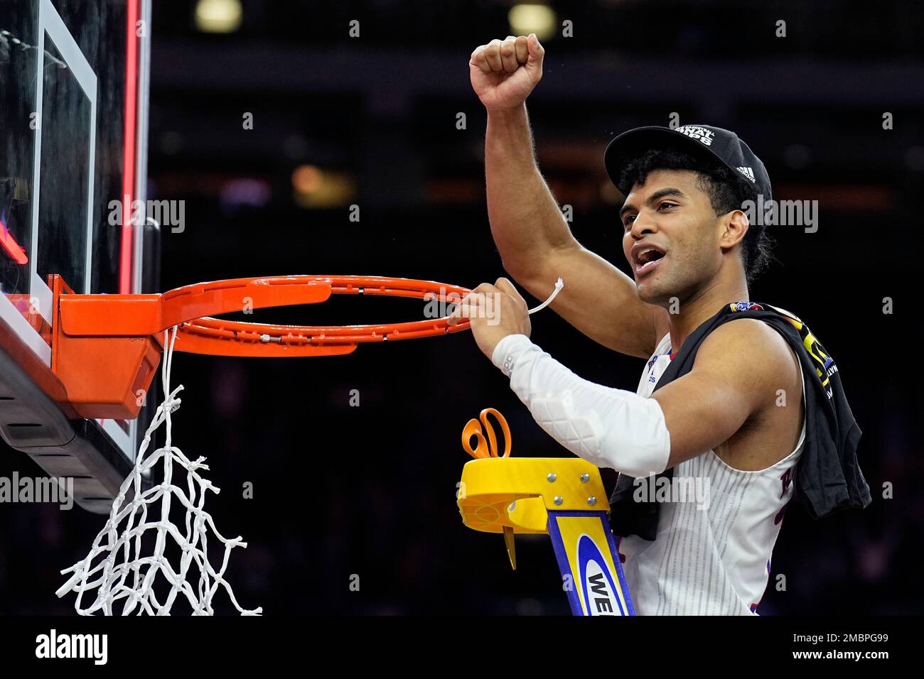 Kansas guard Remy Martin cuts the net after their win against North ...