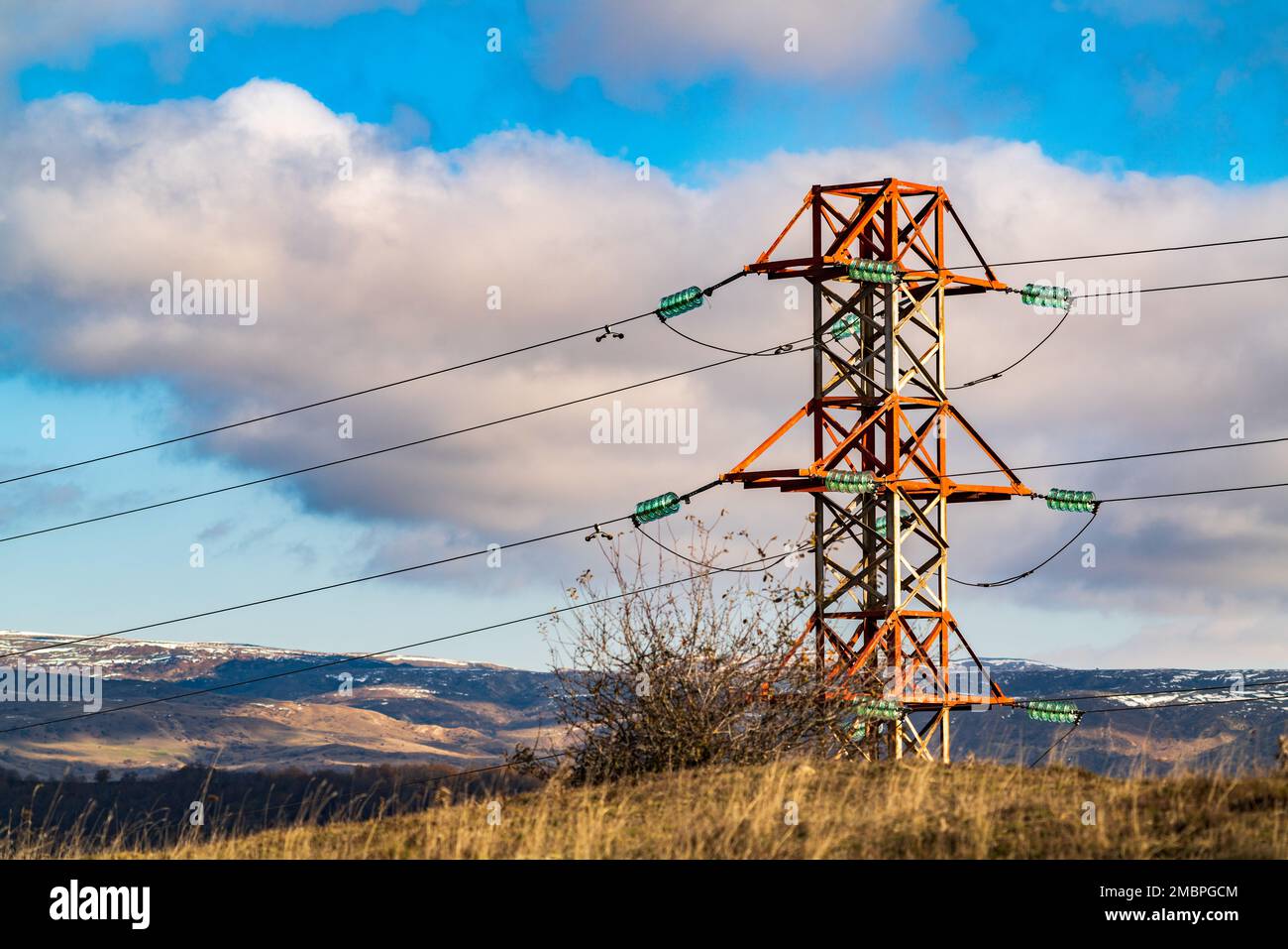 Power towers in farm fields scenery Stock Photo - Alamy