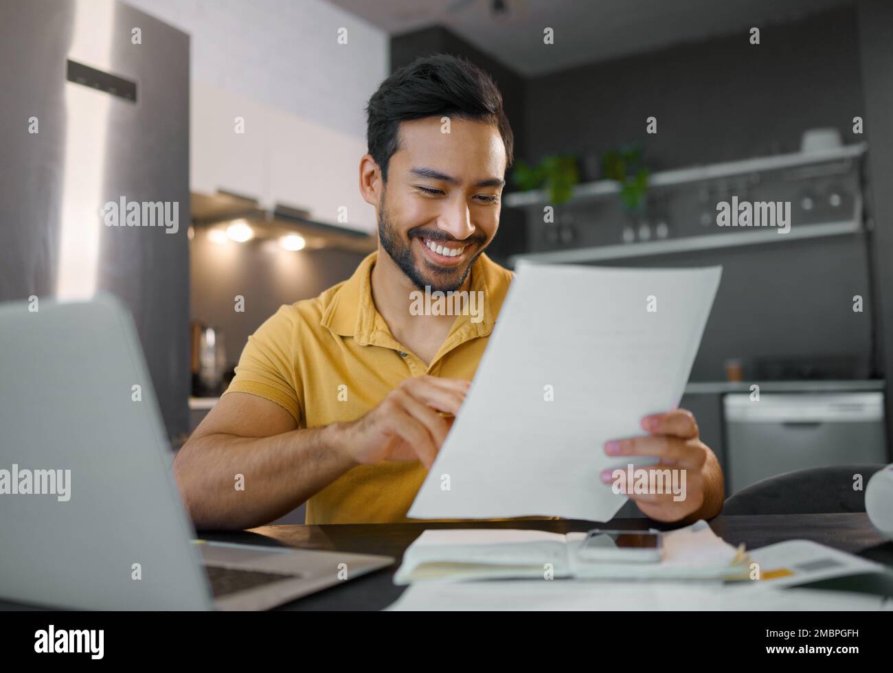 Planning, smile and Asian man with paperwork and a laptop for finance ...