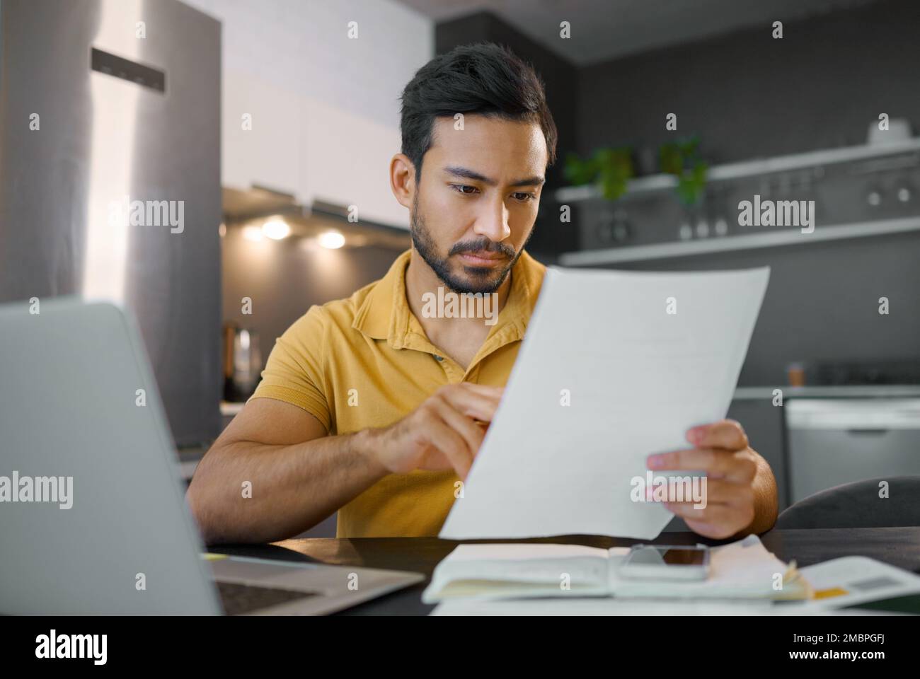 Budget, paperwork and Asian man planning with a laptop for finance ...