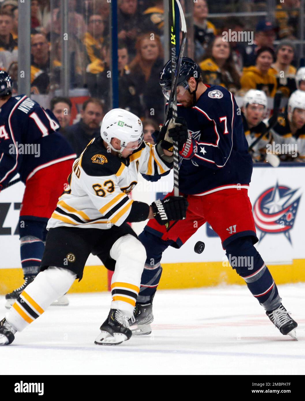 Columbus Blue Jackets forward Sean Kuraly, right, works for the puck in ...
