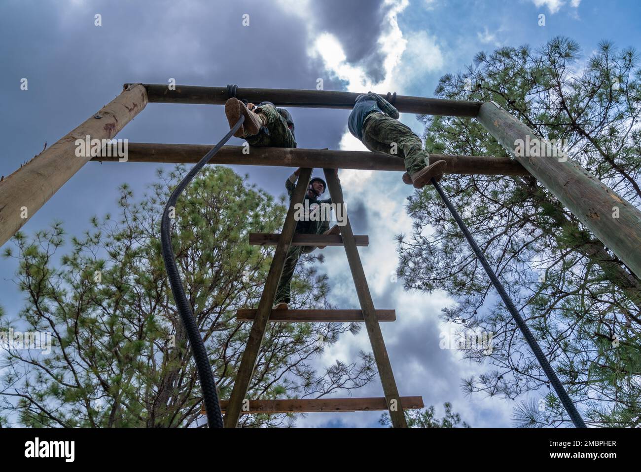 Mexican team members participate in the obstacle course as part of the ...