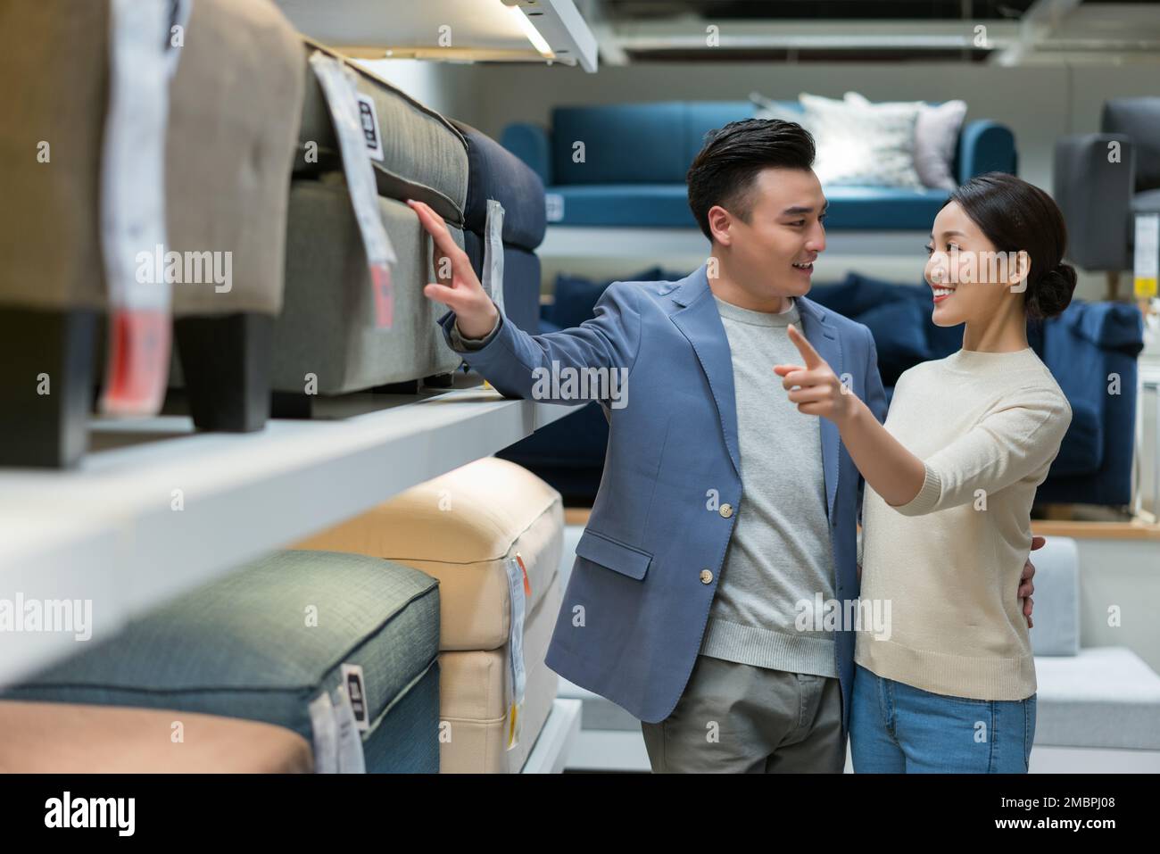 A young couple of choose and buy household items Stock Photo - Alamy