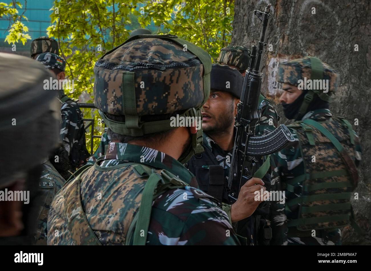 Indian paramilitary soldiers guard near the site of shootout after ...