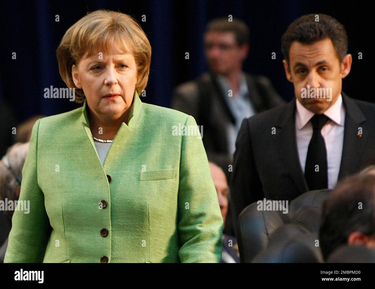 FILE - Former German Chancellor Angela Merkel, left, and former French ...