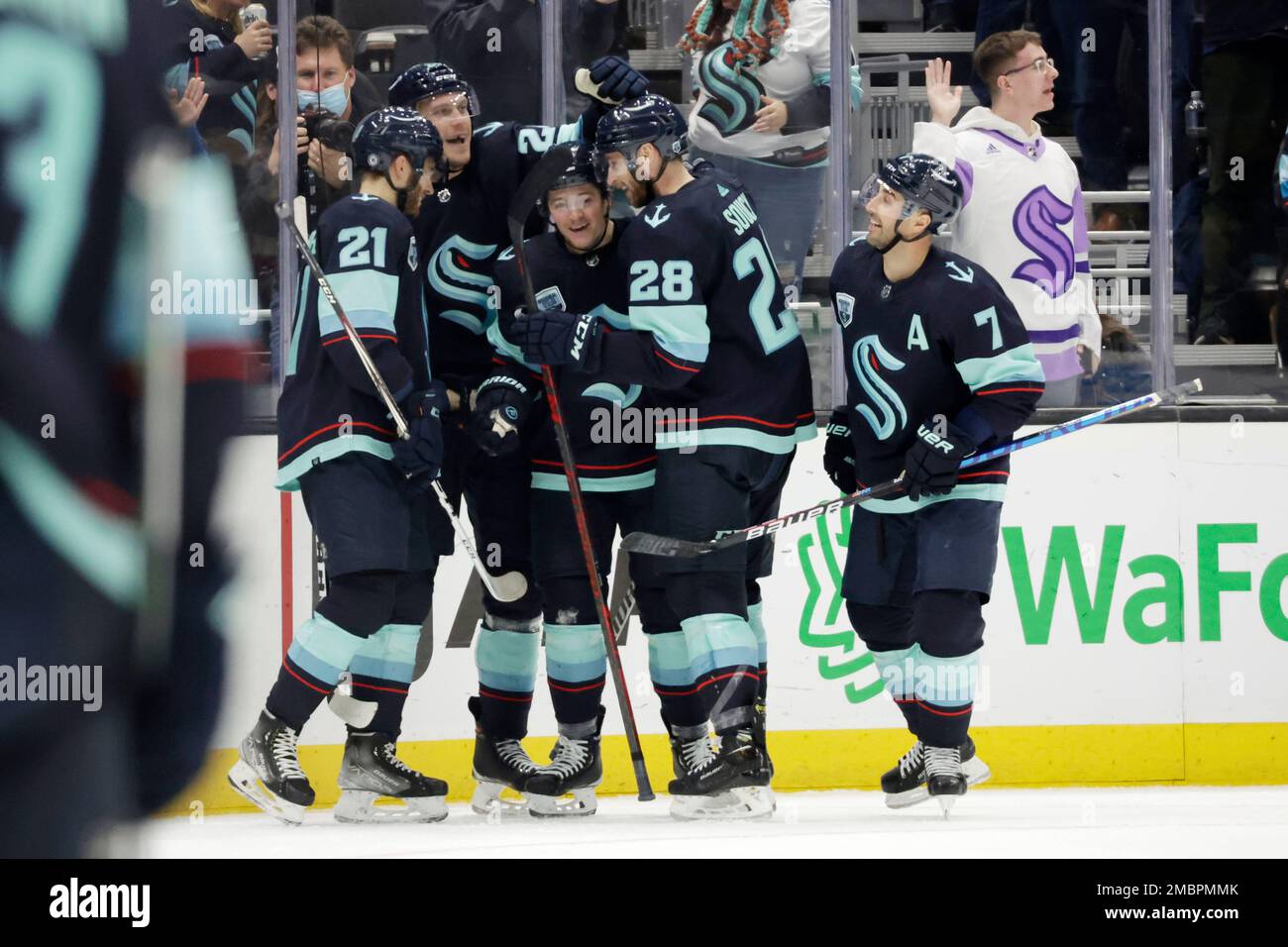 Seattle Kraken center Ryan Donato, center, is surrounded by center Alex ...