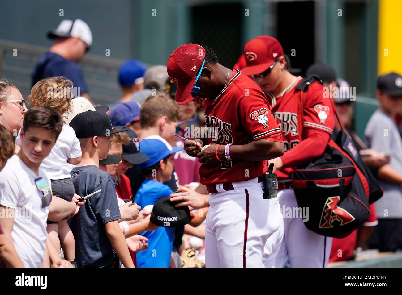 Arizona Diamondbacks' Geraldo Perdomo, left, and Jake McCarthy sign ...
