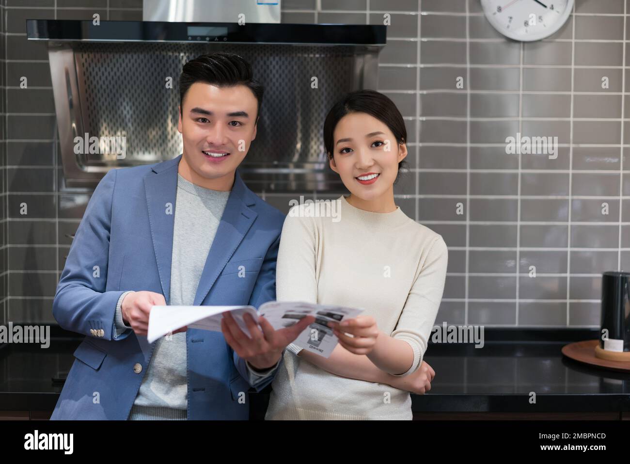 A young couple of choose and buy household items Stock Photo - Alamy